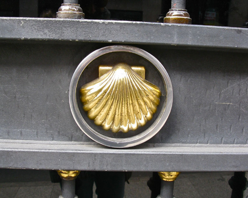 Golden scallop shell on church | Indalo Camino good luck gifts